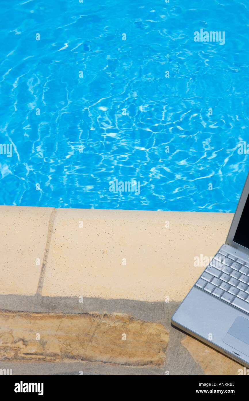 LAPTOP COMPUTER BESIDE A SWIMMING POOL Stock Photo - Alamy