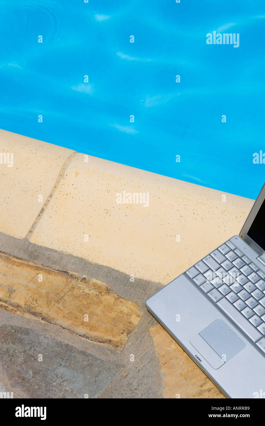 LAPTOP COMPUTER BESIDE A SWIMMING POOL Stock Photo - Alamy