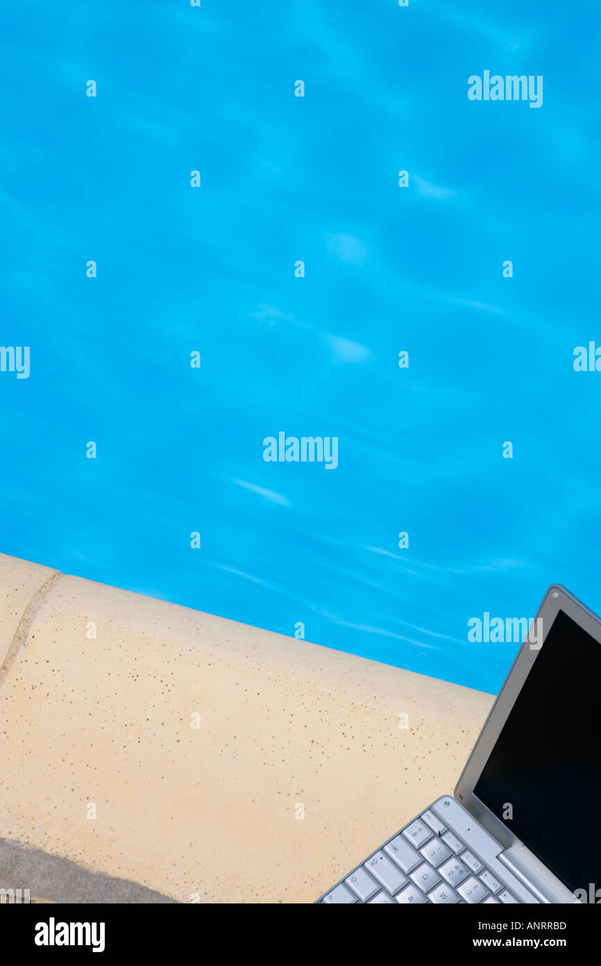 LAPTOP COMPUTER BESIDE A SWIMMING POOL Stock Photo - Alamy
