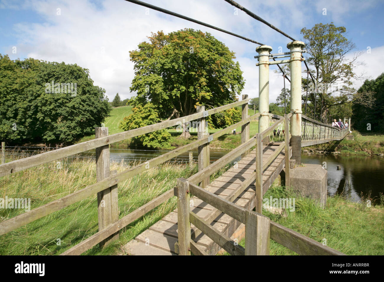 Suspension footbridge over the River Wharfe near Hebden, Yorkshire ...