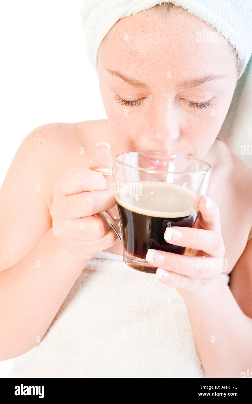 Studio portrait of a spa girl smelling her coffee Stock Photo - Alamy