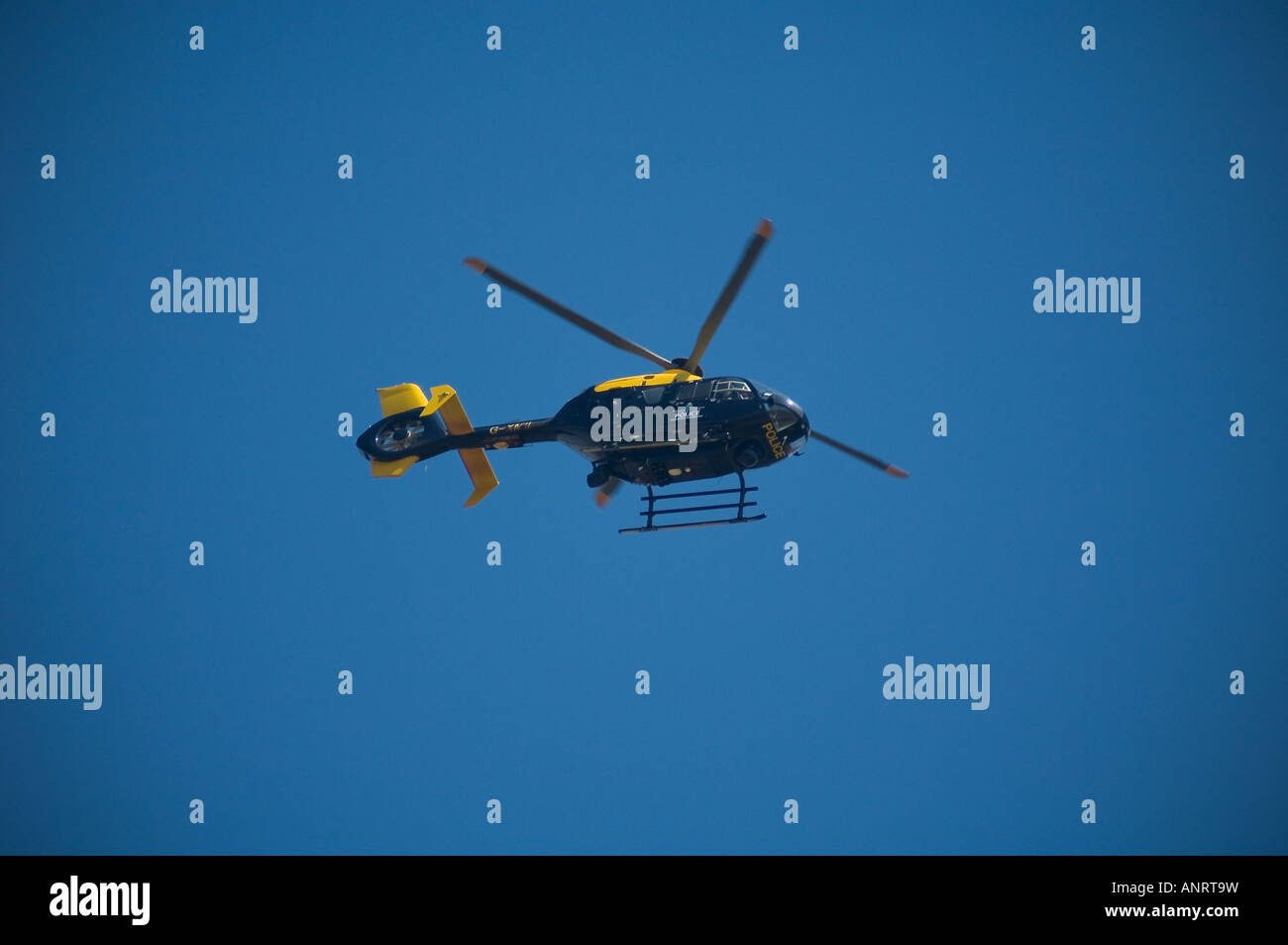 Merseyside police helicopter seen against a clear blue sky Stock Photo ...
