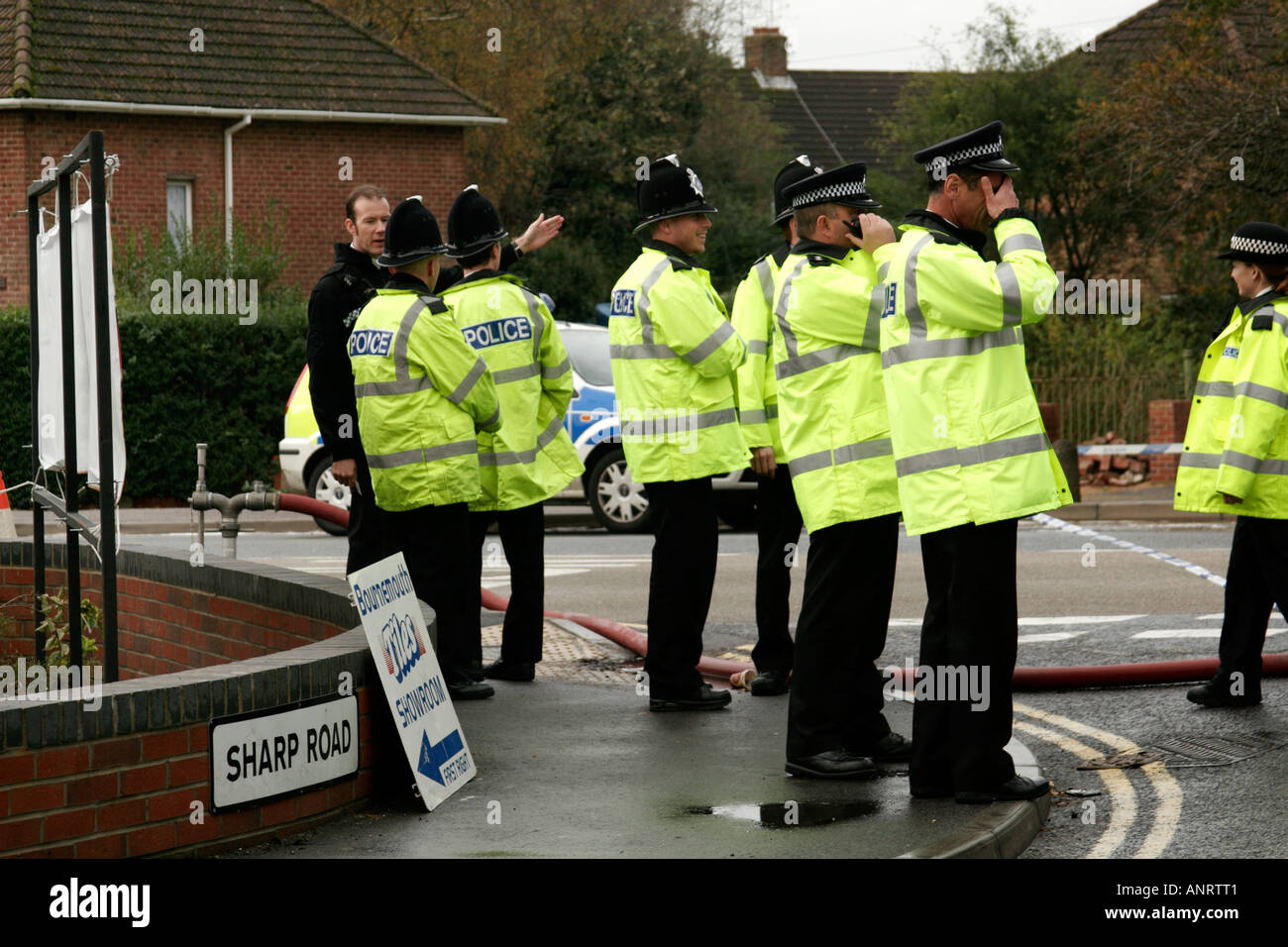 Group of policemen standing on pavement Stock Photo - Alamy
