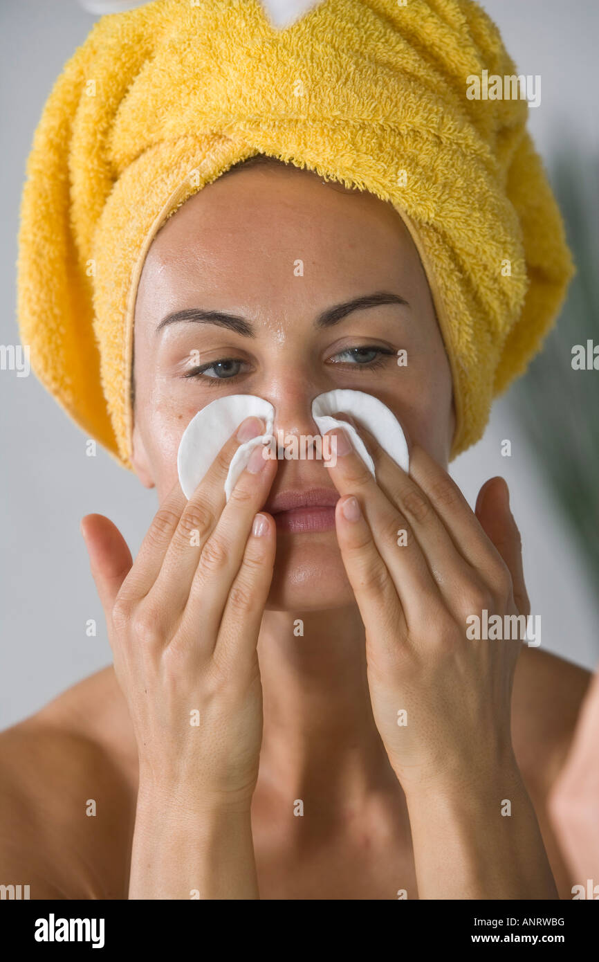 young woman taking care of her face Stock Photo - Alamy