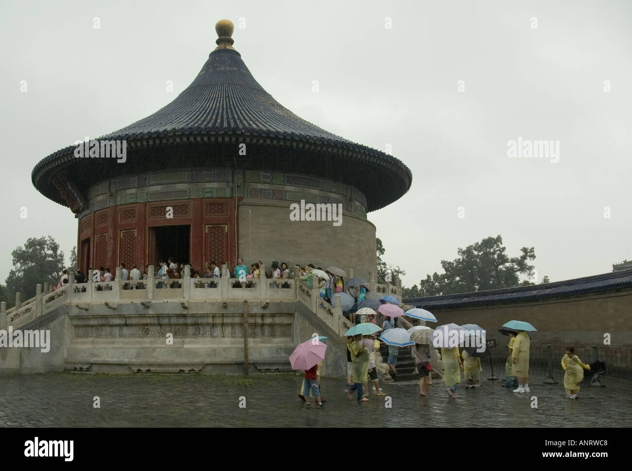 The temple of heaven with visitors on a rainy day, Beijing, China Stock ...
