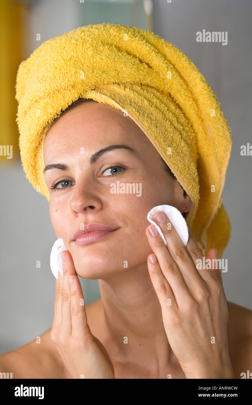 young woman taking care of her face Stock Photo - Alamy