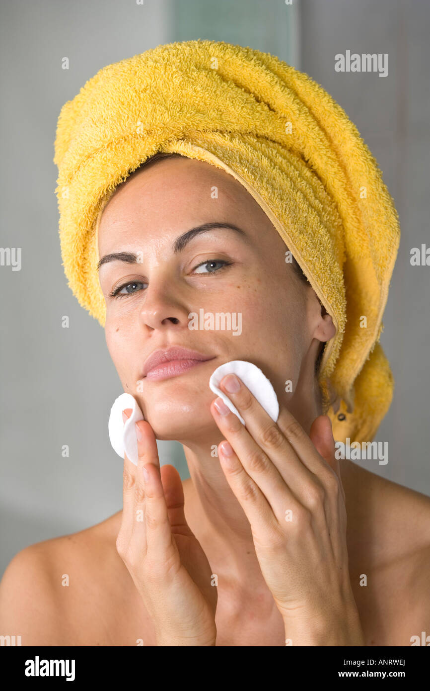 young woman taking care of her face Stock Photo - Alamy