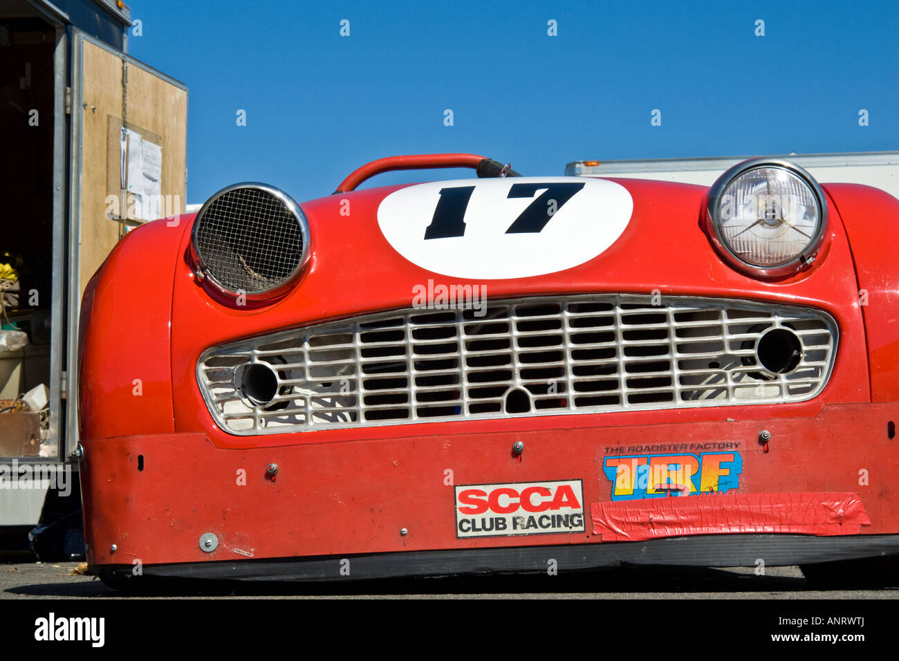 Red racecar number 17 with broken headlight Stock Photo - Alamy