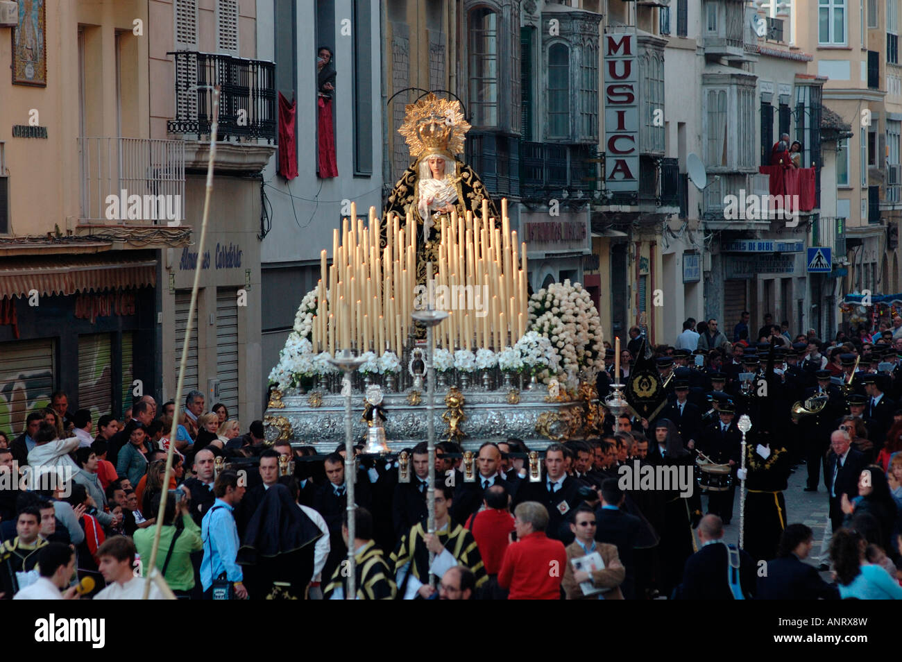Crowds of people enjoy the Holy Week street processions in Malaga ...