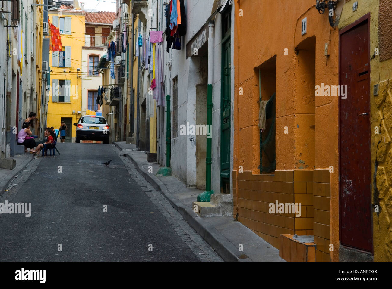Colourful back street houses in the medieval city town of Perpignan ...