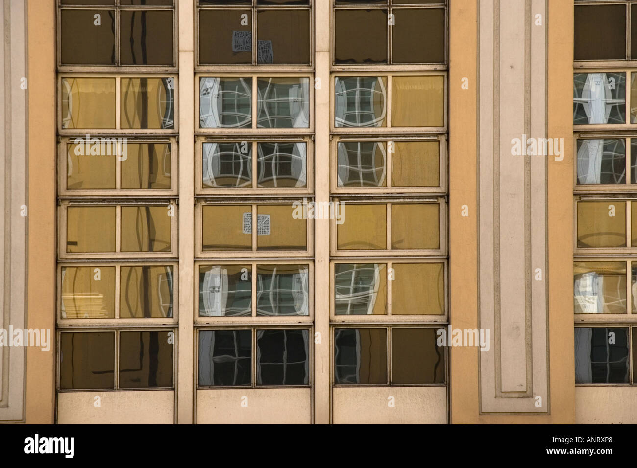 Reflections of a building in square window panes Stock Photo - Alamy