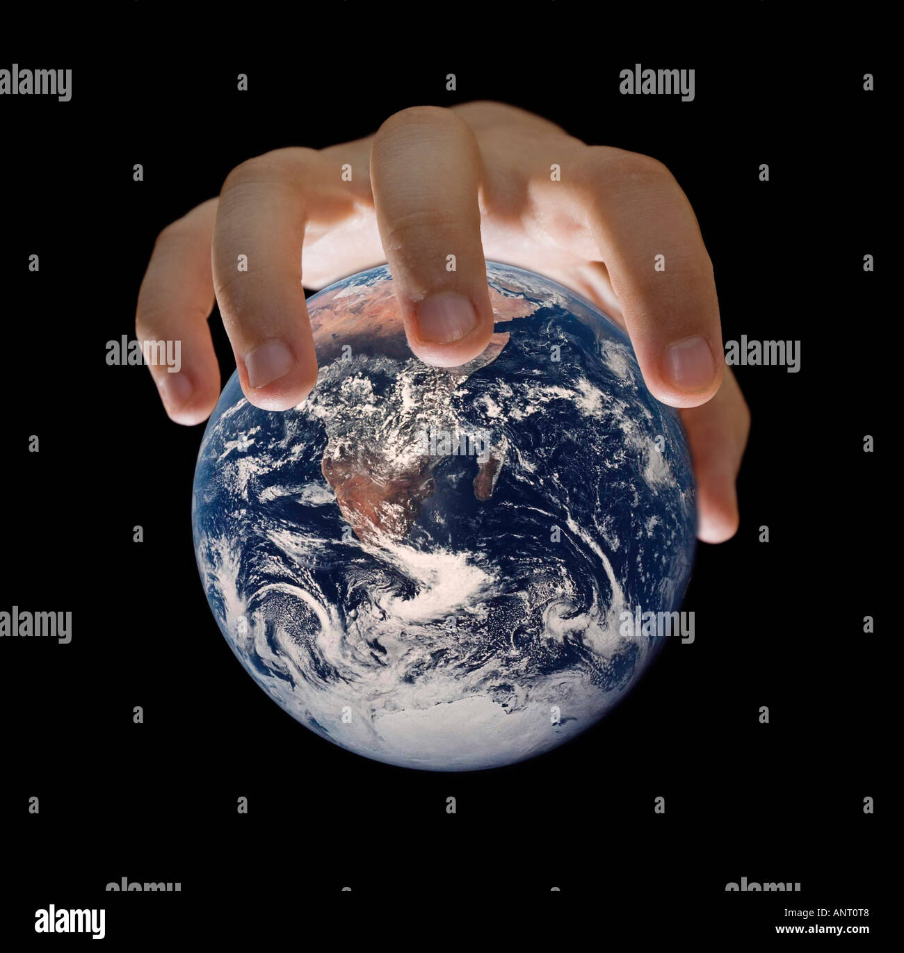 Stock photo of a hand reaching over the globe Stock Photo - Alamy