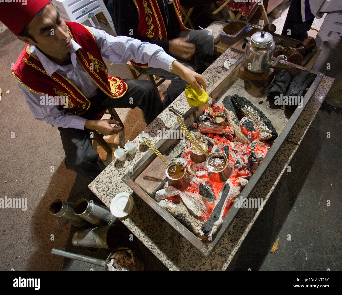 Preparing Traditional Turkish Coffee Fez capped barista prepares four ...