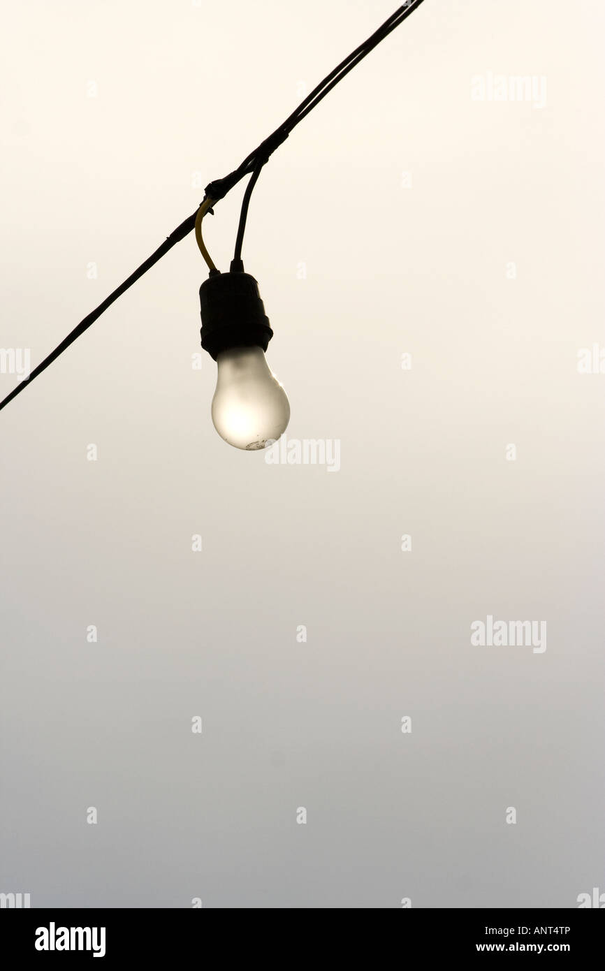 A bulb hanging from a wire Stock Photo - Alamy