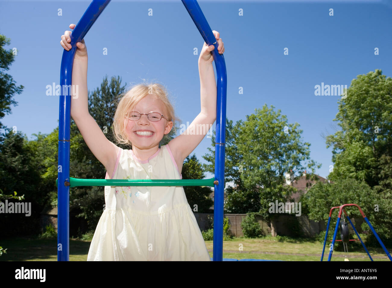 PJB Images,Girl standing on climbing frame Stock Photo - Alamy