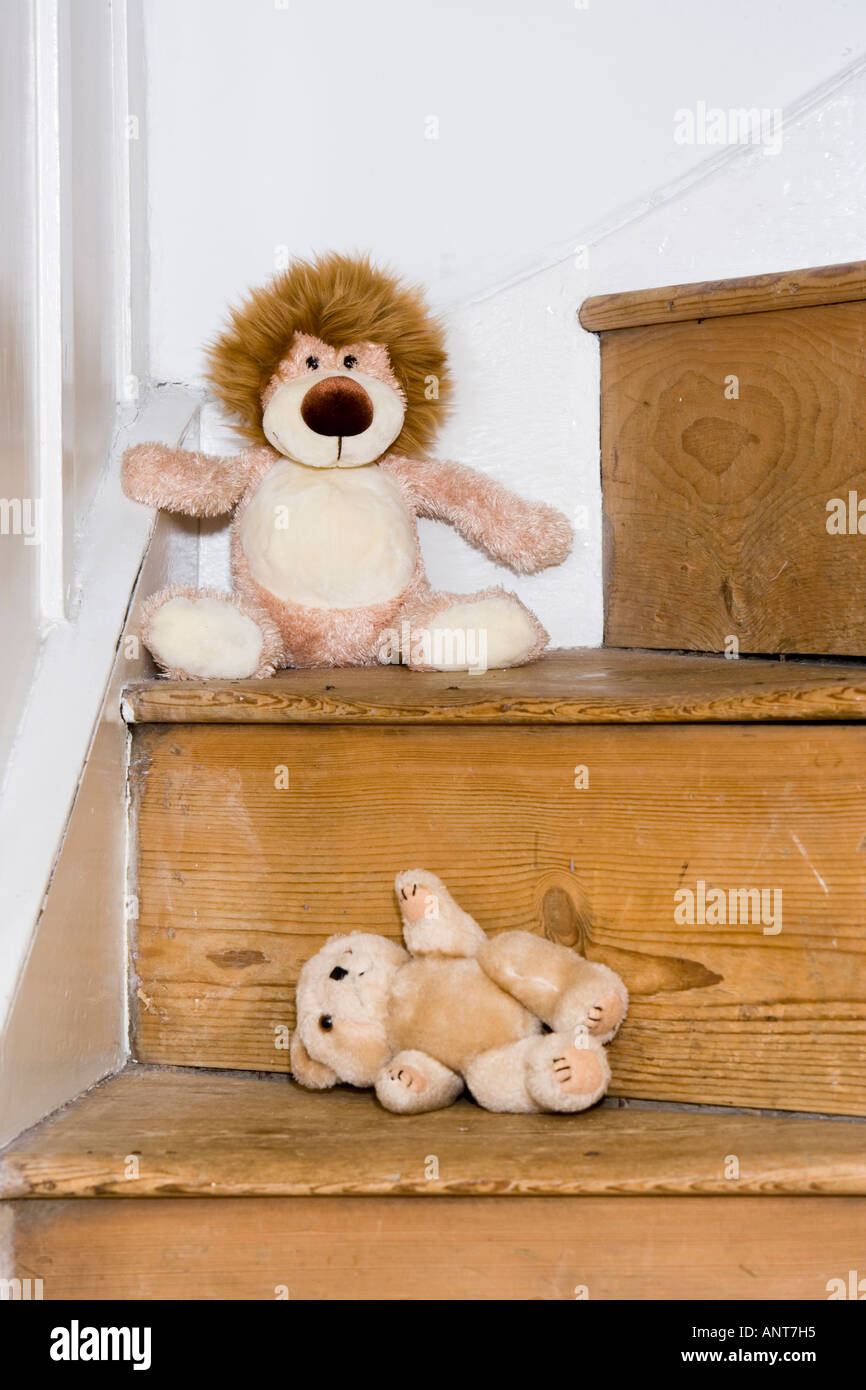 Two soft toys on stairs Stock Photo - Alamy
