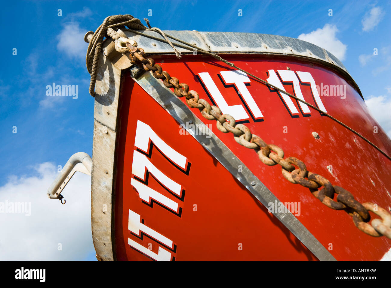 Bright red fishing boat anchored, close-up Stock Photo - Alamy