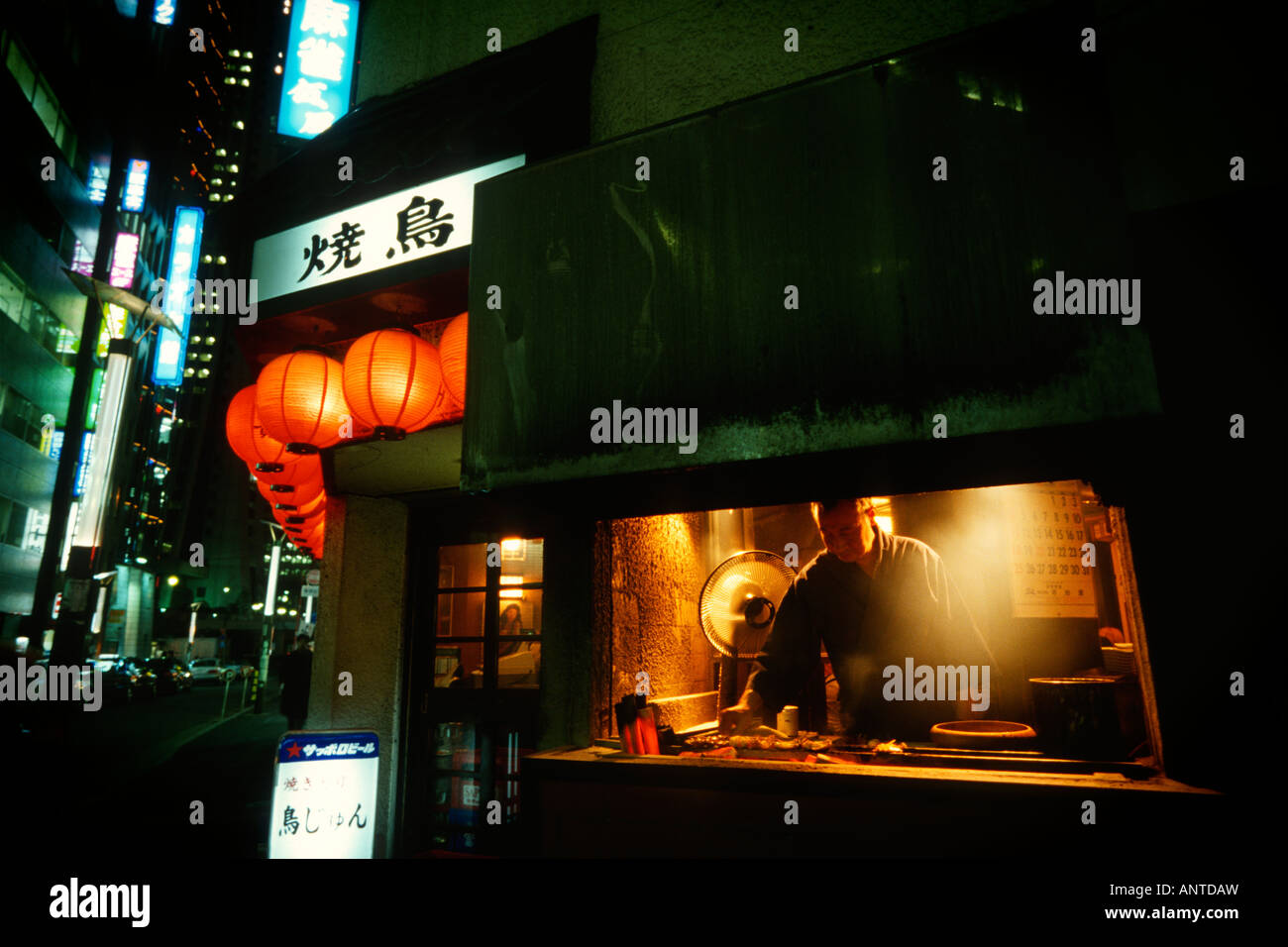 Tokyo Japan Chef cooking in open fronted restaurant in Shinjuku Stock ...