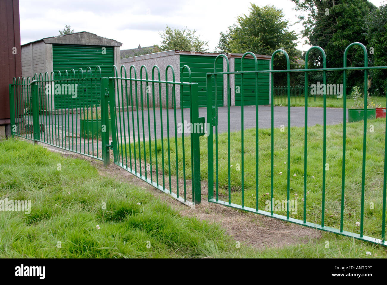 Green gate slightly open close up England UK Stock Photo - Alamy