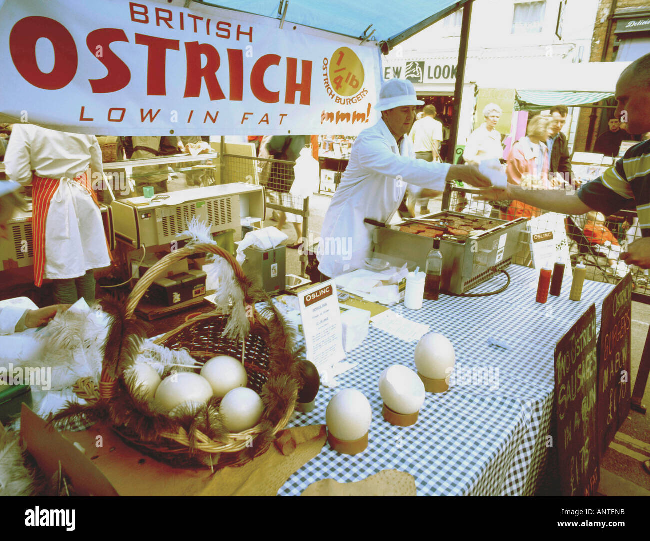 A stallholder from a local farm sells his produce of Ostrich meat and ...