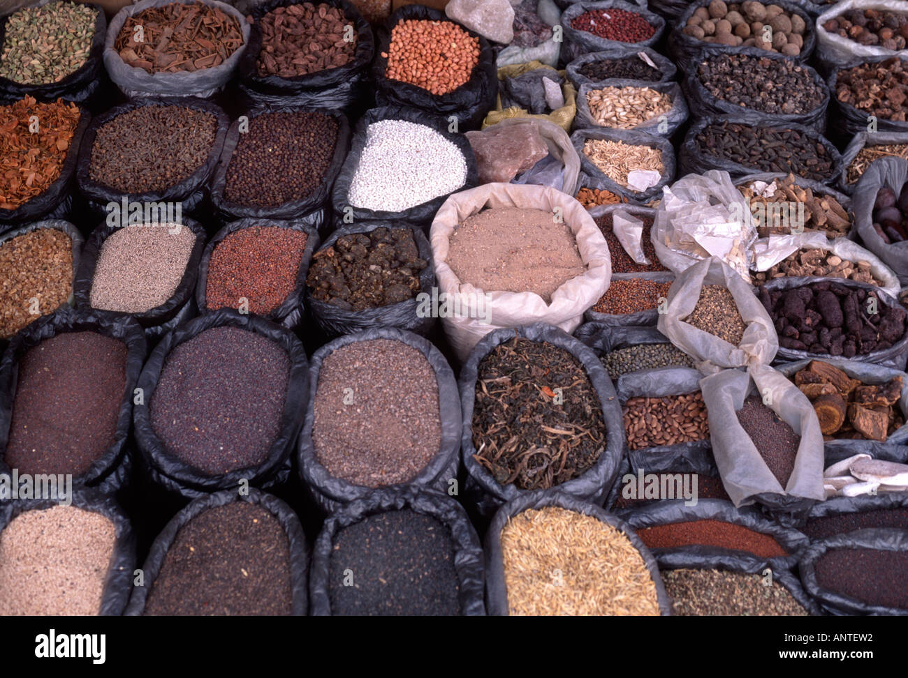 Various grains herbs and beans sold in a market Stock Photo - Alamy