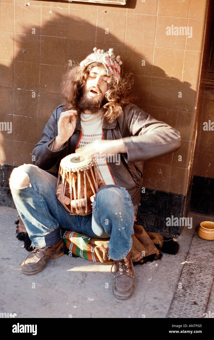 Hippie playing drums in Portobello Road London 1972 Stock Photo - Alamy