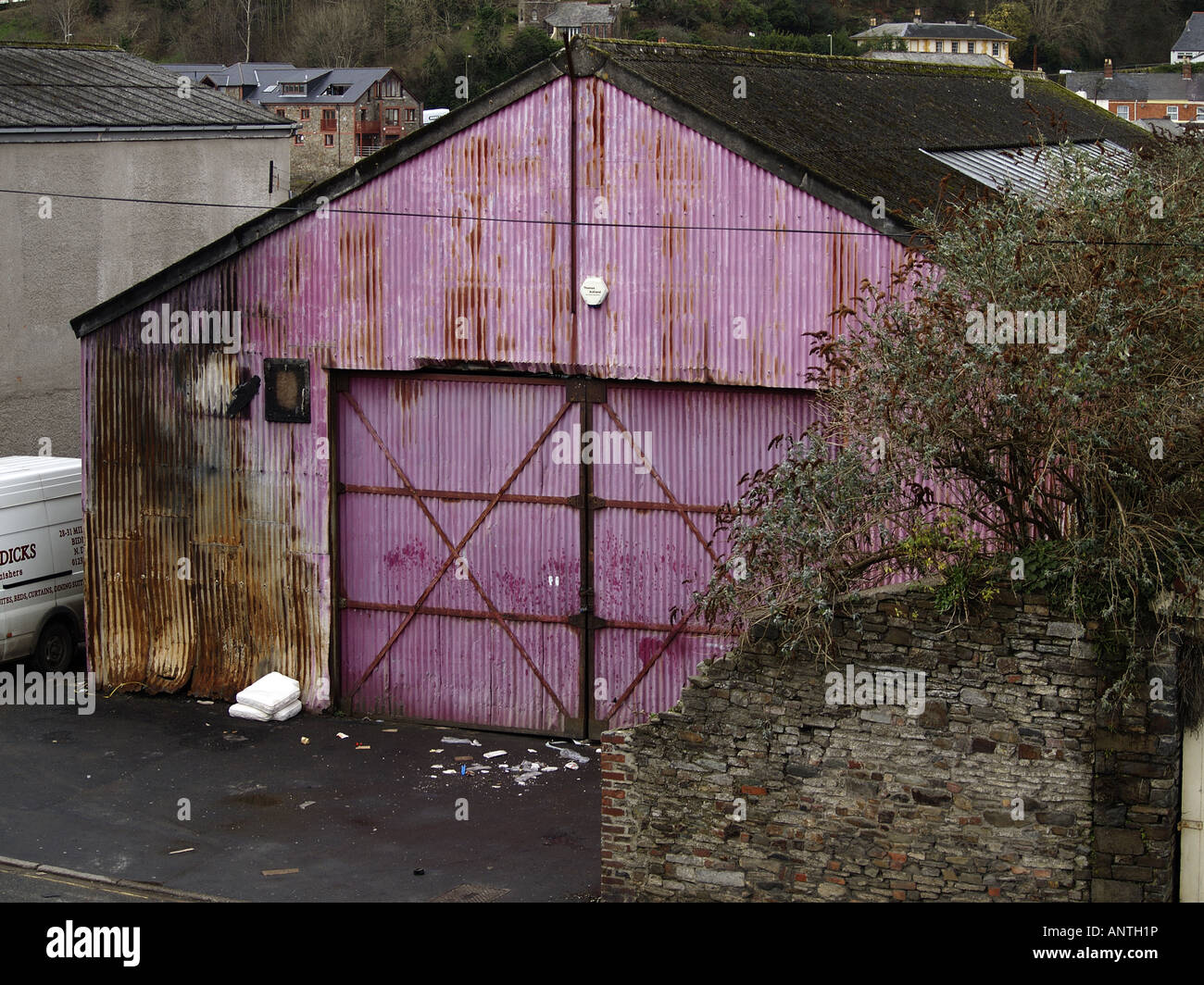 Derelict purple warehouse, rusted Stock Photo - Alamy
