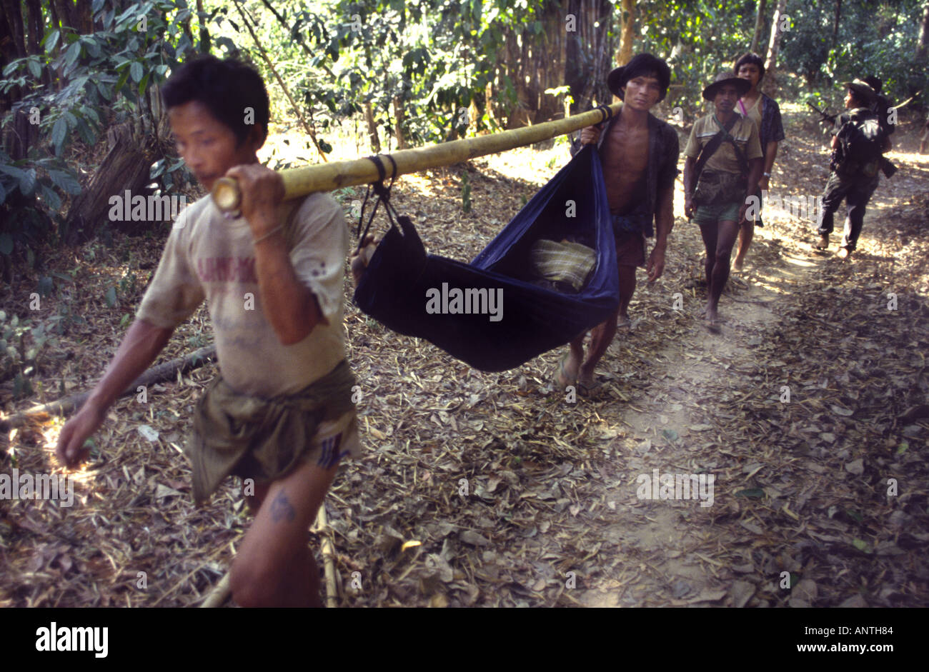 A dead KNLA fighter is carried to the rear Kawtholei Burma Stock Photo ...