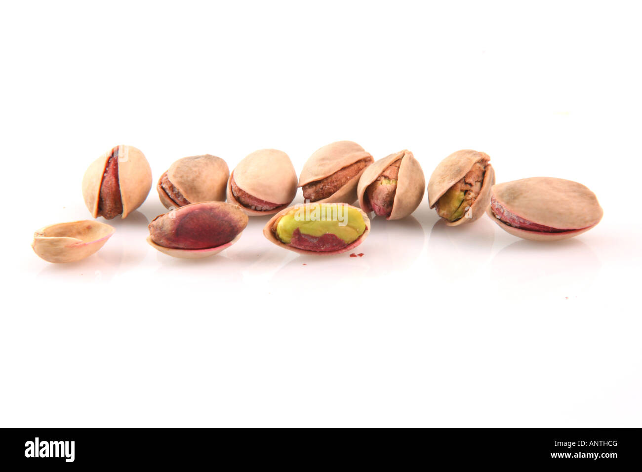 open pistachios isolated on white background food concepts Stock Photo ...