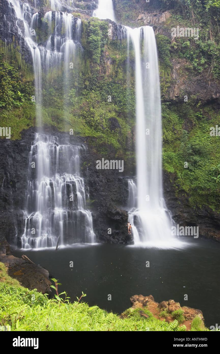 Tourists Under Tat Luang Waterfall Stock Photo - Alamy