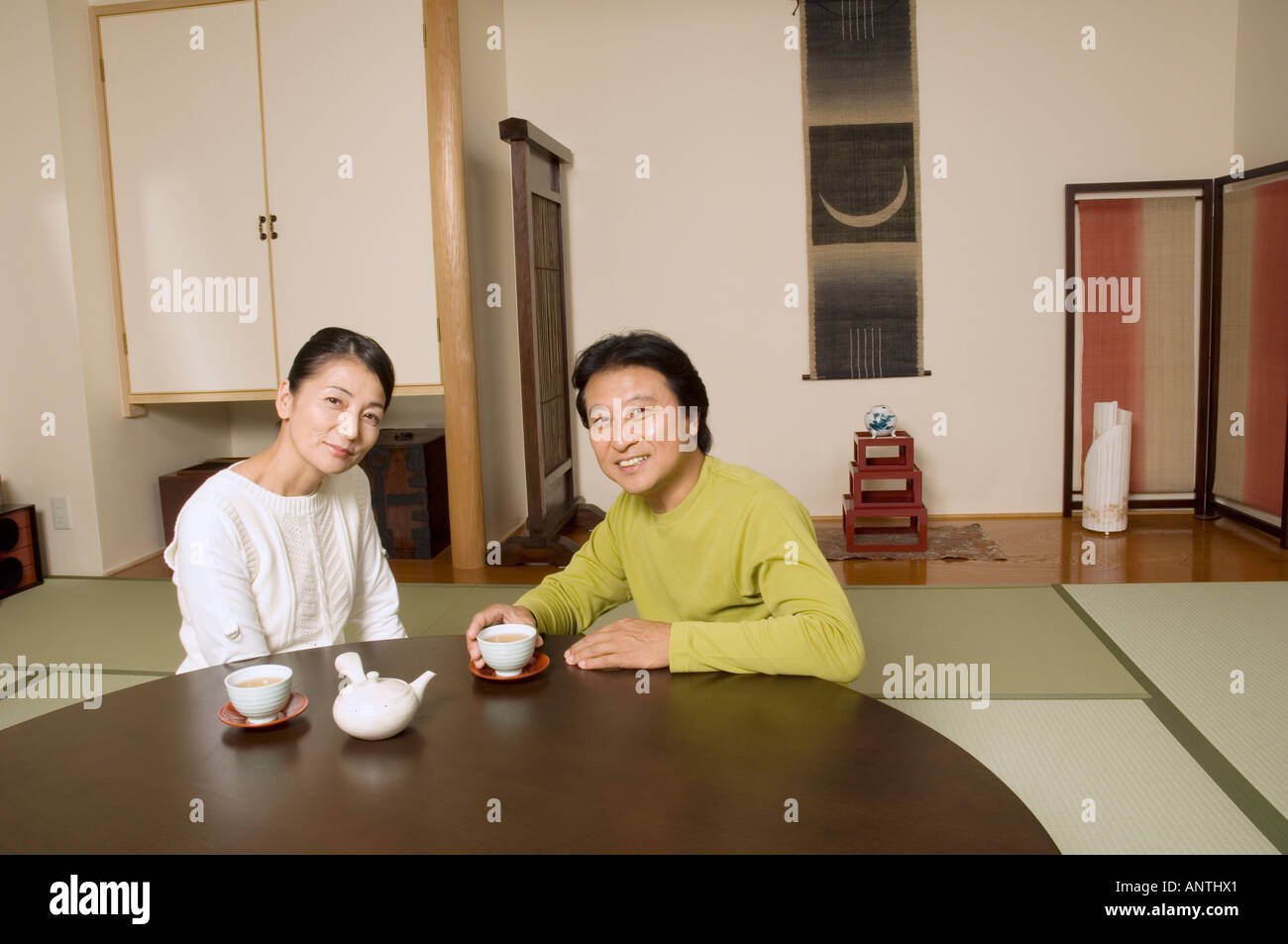 Mature couple having tea Stock Photo - Alamy