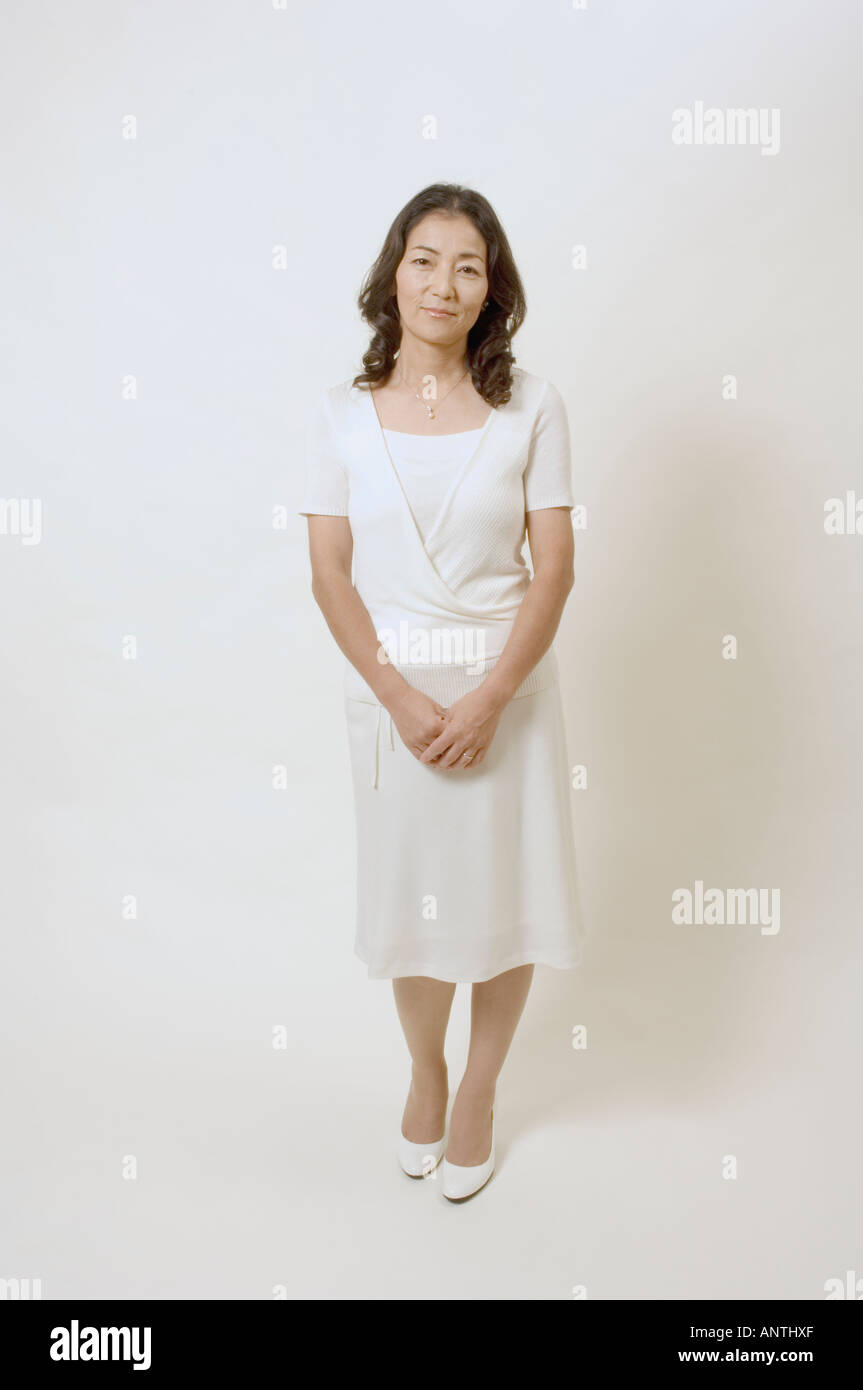 Mature woman standing Stock Photo - Alamy