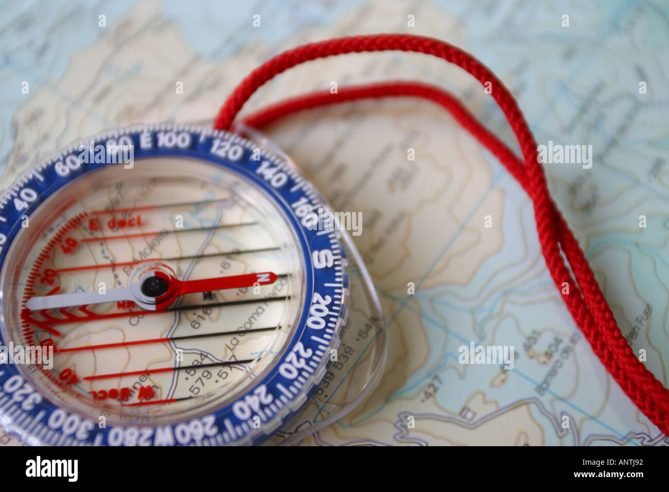 Compass and map Stock Photo - Alamy