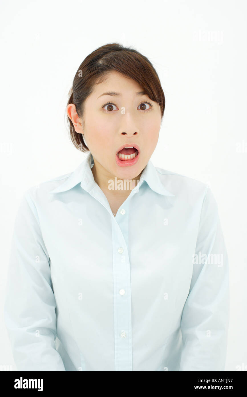 Young woman gasping Stock Photo - Alamy