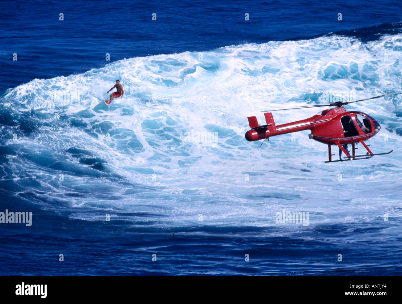 SURFER RIDING A WAVE JAWS MAUI Stock Photo - Alamy