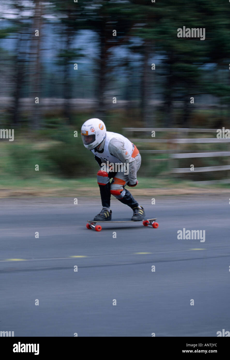 MAN RACING DOWN ROAD ON A SPEEDBOARD Stock Photo - Alamy