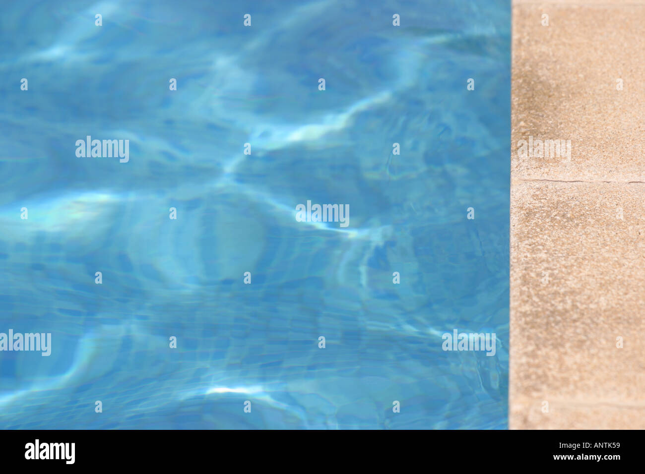 Luxury swimming pool blue water poolside Stock Photo - Alamy