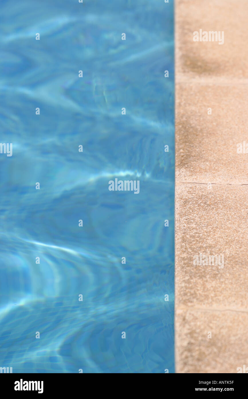 Swimming pool blue water poolside Stock Photo - Alamy