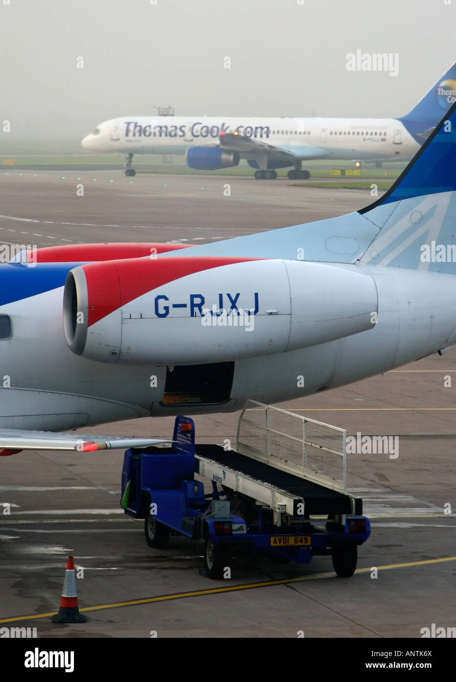 BMI plane unloading luggage Stock Photo - Alamy