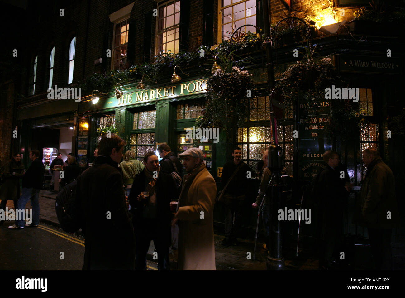 Drinkers stand outside the Market Porter pub, Borough Market, South ...