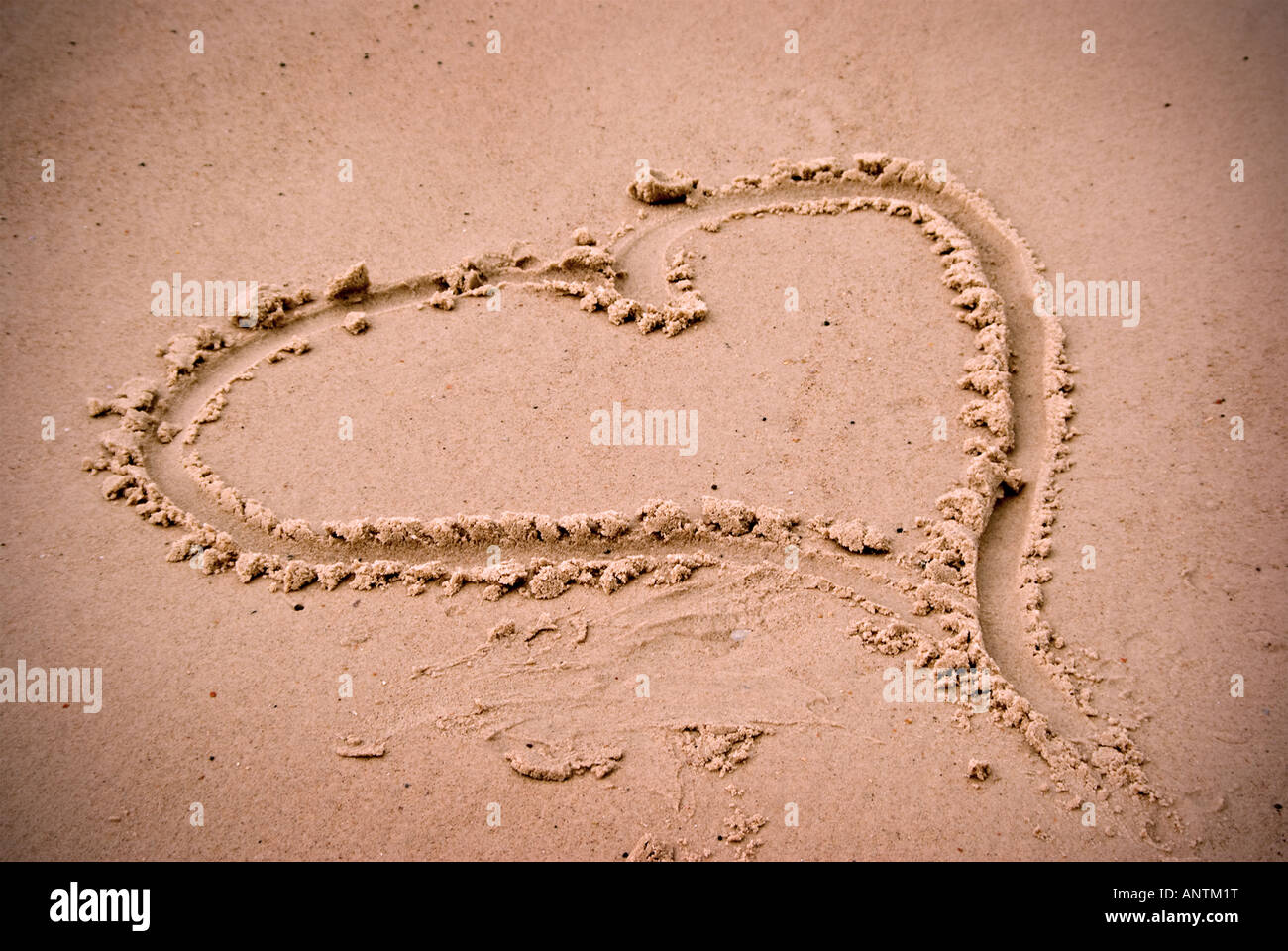 a love heart drawn in the sand at the beach Stock Photo - Alamy