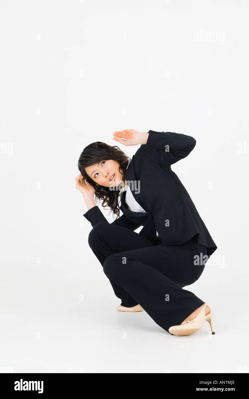 Young woman ducking Stock Photo - Alamy