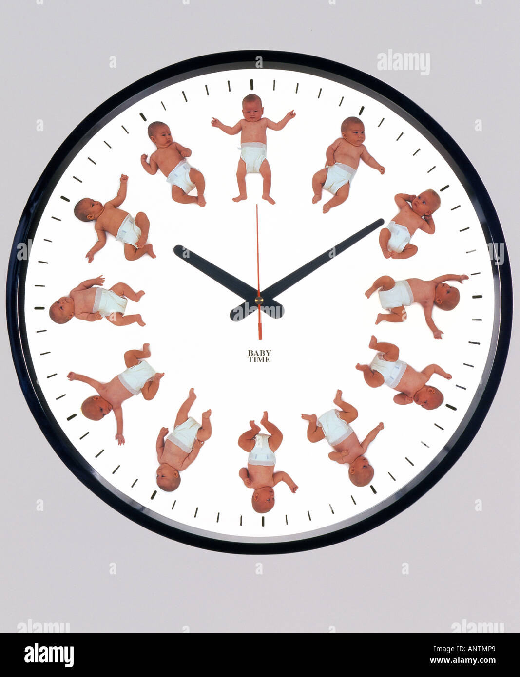 Baby and clock hi-res stock photography and images - Alamy