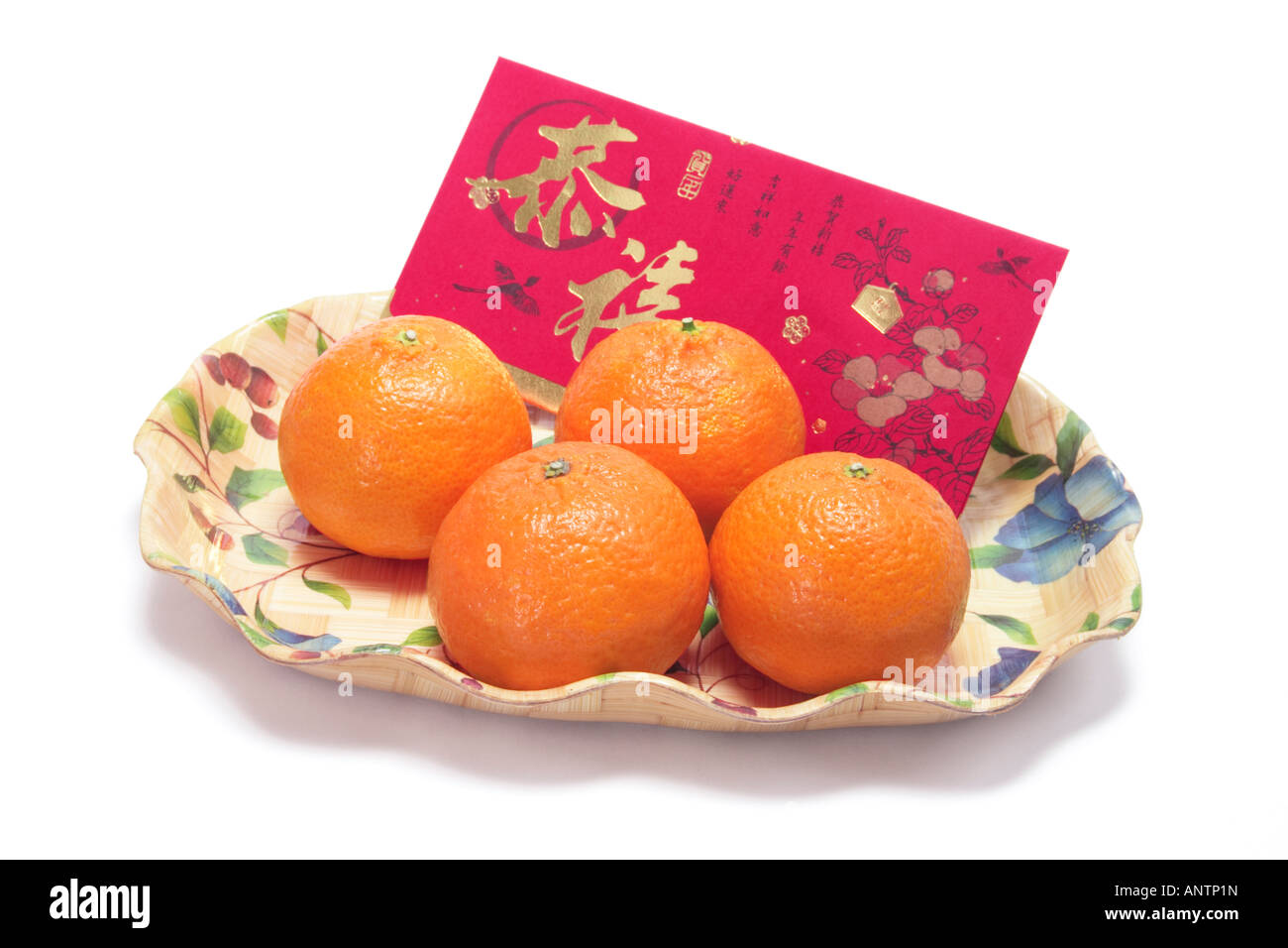 Mandarins and Red Packet on Tray Stock Photo - Alamy