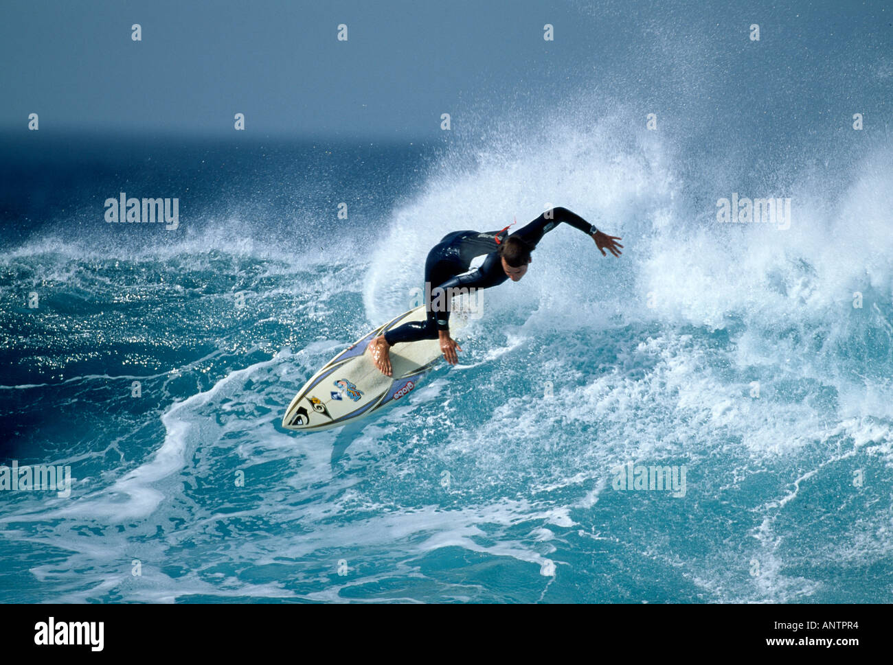 SURFER RIDING A WAVE Stock Photo - Alamy