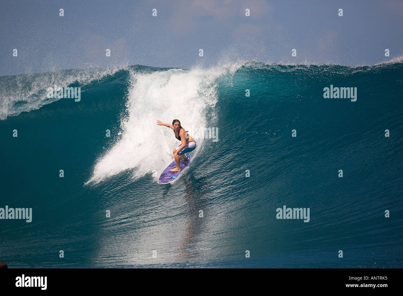SURFER RIDING WAVE AT SPEED INDONESIA Stock Photo - Alamy