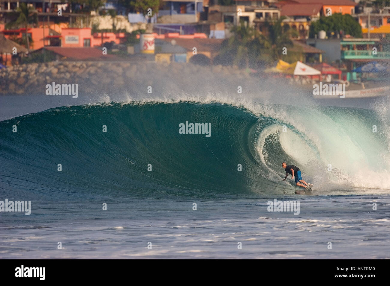 SURFER RIDING THROUGH BARREL MEXICO Stock Photo - Alamy