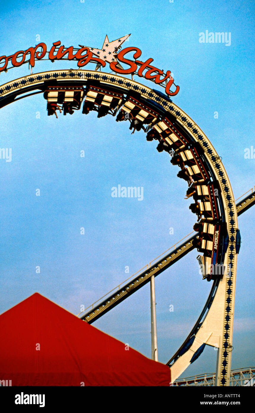 Roller coaster riders at a Texas state fair Stock Photo - Alamy