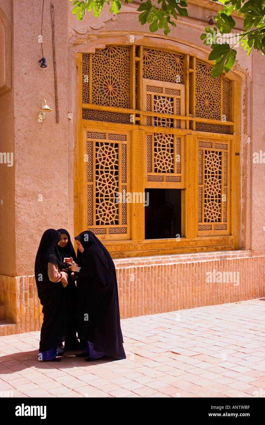 Young iranian women visiting one of the traditional houses in Yazd Iran ...