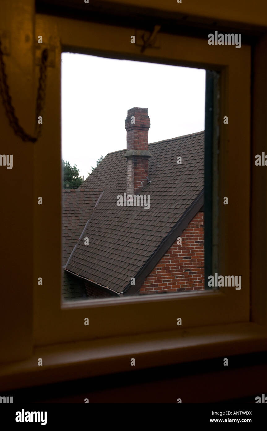 View through a window of a brick house with a chimney in Tacoma WA USA ...